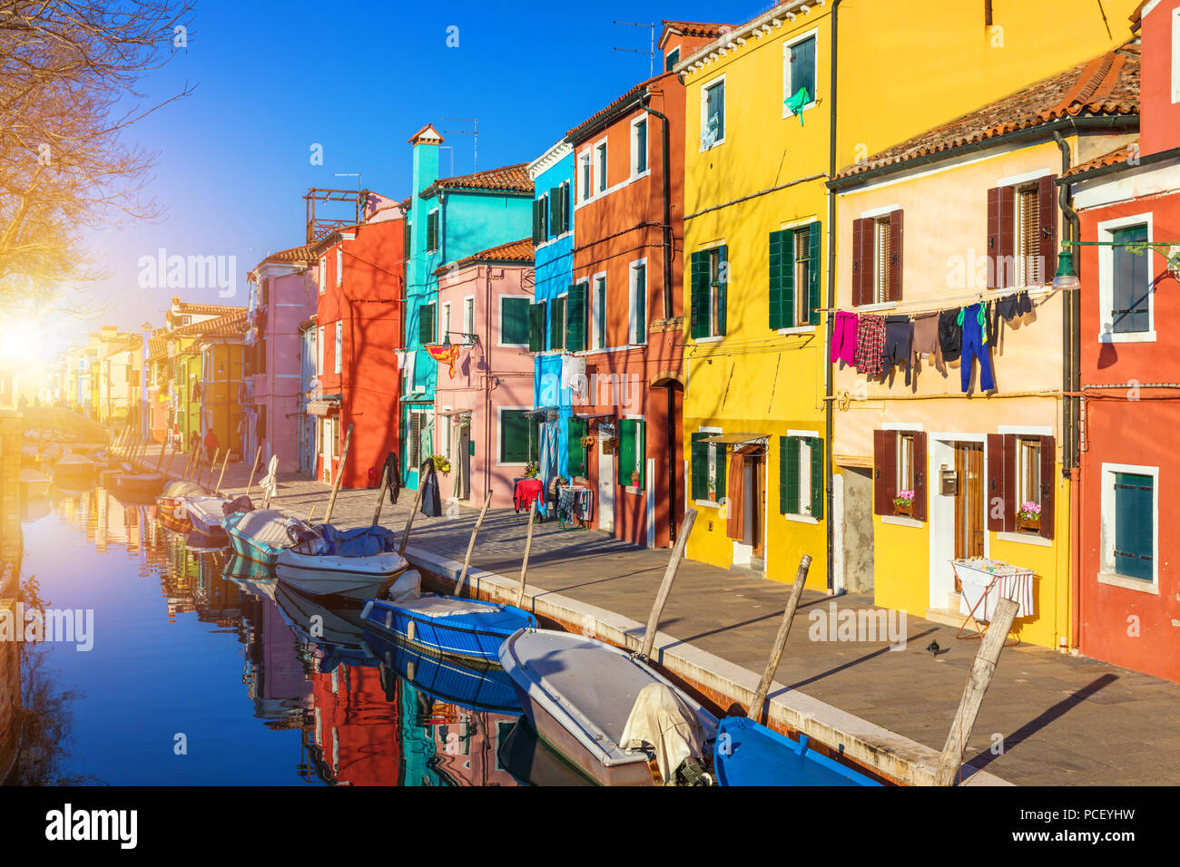 Street with colorful buildings in Burano island, Venice, Italy ...