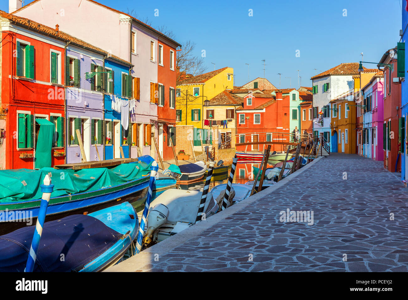 Street with colorful buildings in Burano island, Venice, Italy ...