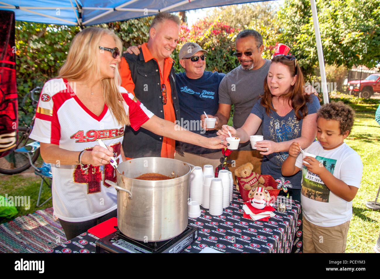 At a community gathering in a Costa Mesa, CA, park, young and old ...