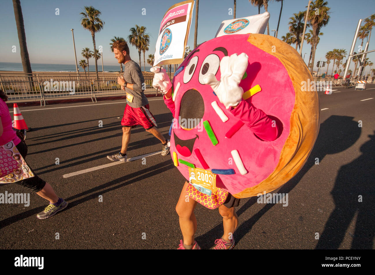 A marathon runner wearing a jelly donut costume and called "The Great ...