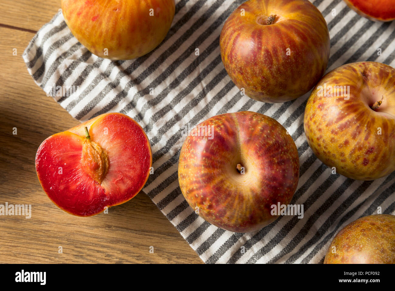 Organic Red Mottled Pluots Ready to Eat Stock Photo - Alamy