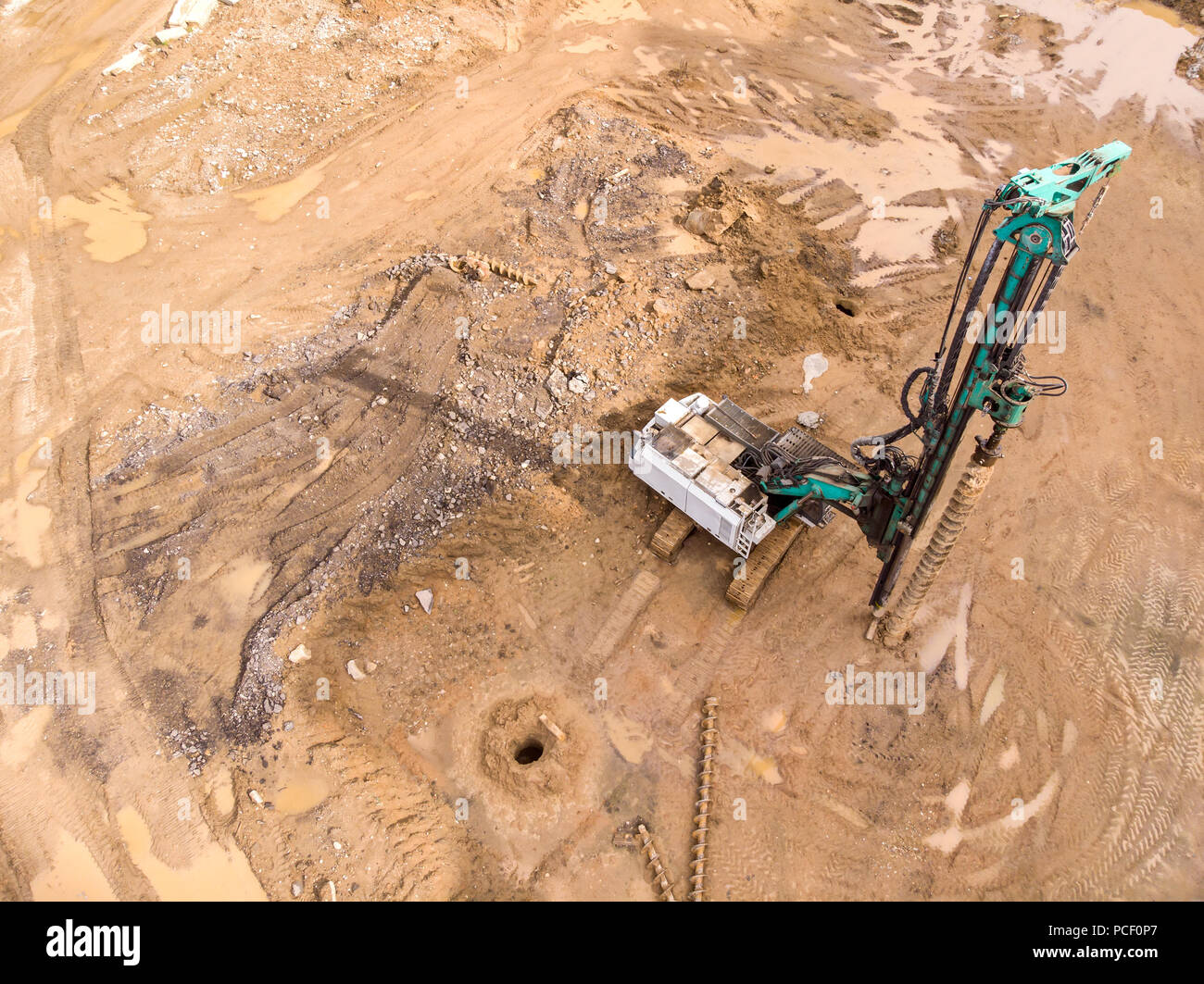 building site in stage of preparation of the ground with a drilling rig ...