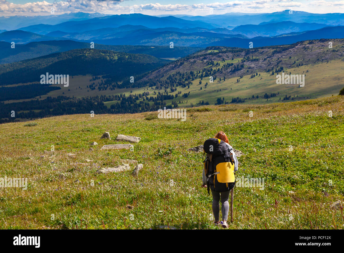 Travel Lifestyle and survival concept rear view. Hiking woman with ...