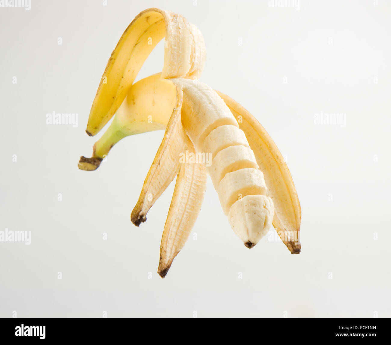 Cut-ed ripe banana isolated on white background Stock Photo - Alamy