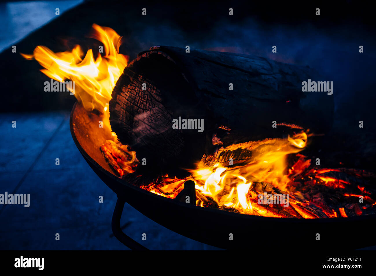 Night scene of fire sparks and flame burning with beautiful red flame ...