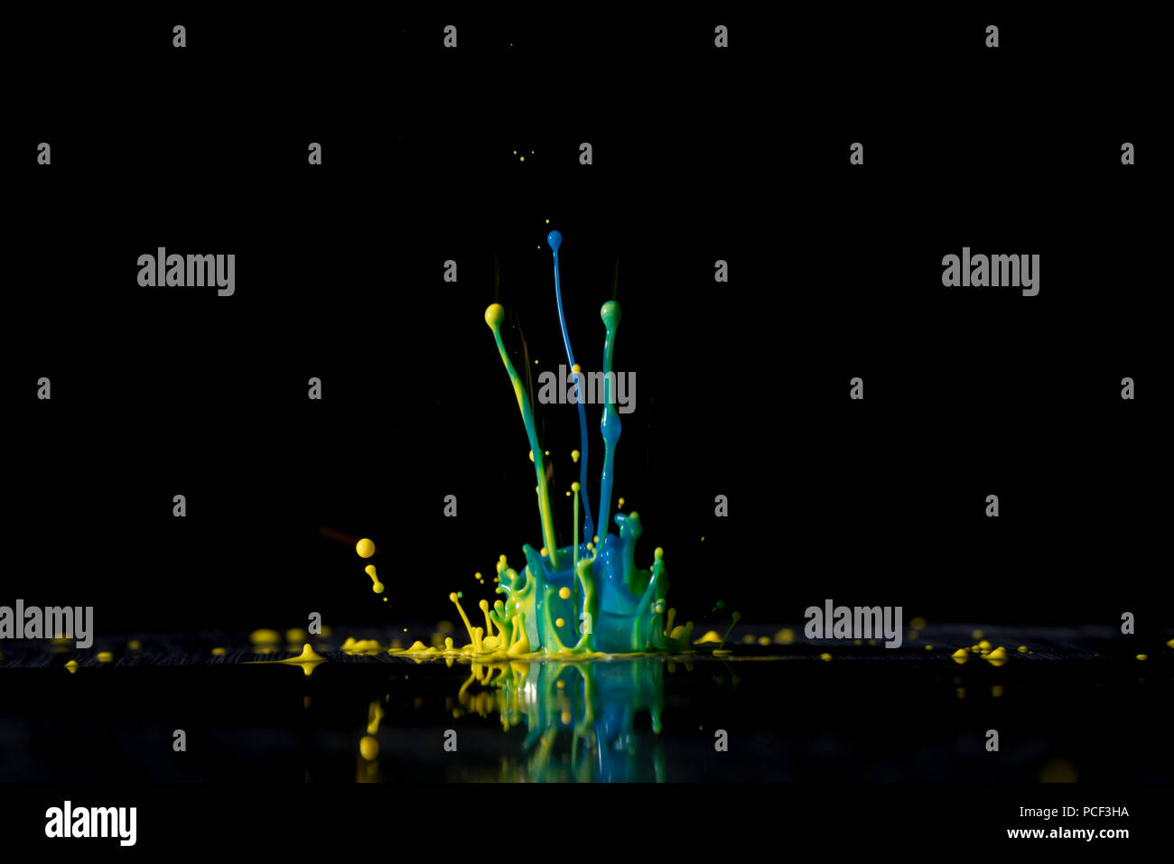 Abstract sculptures of colorful splashes of paint. Dancing liquid on a ...