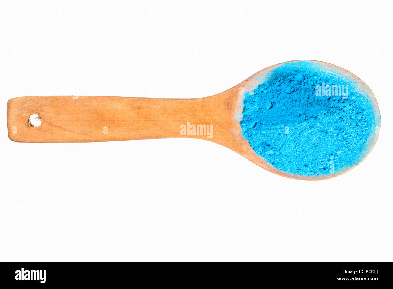 blue powder on wooden spoon with clipping path in isolated on white ...