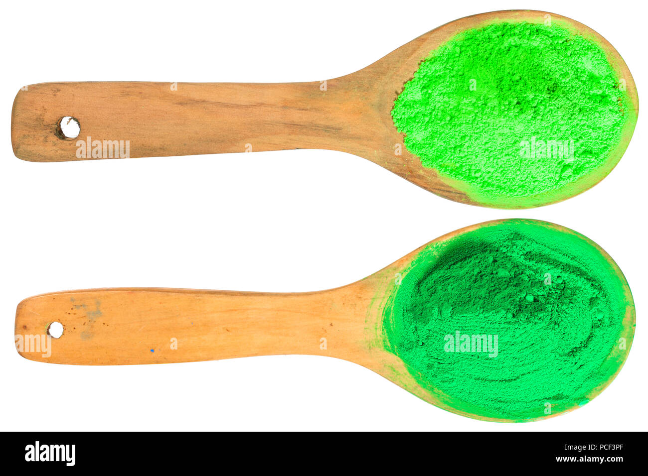 green and light green powder on wooden spoons with clipping path in ...
