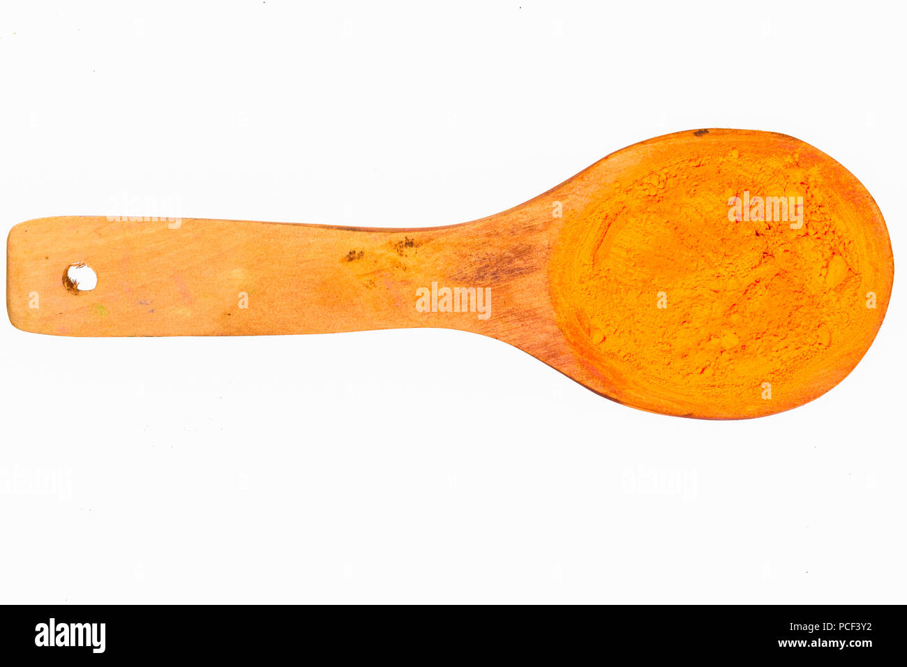 orange powder on wooden spoon with clipping path in isolated on white ...