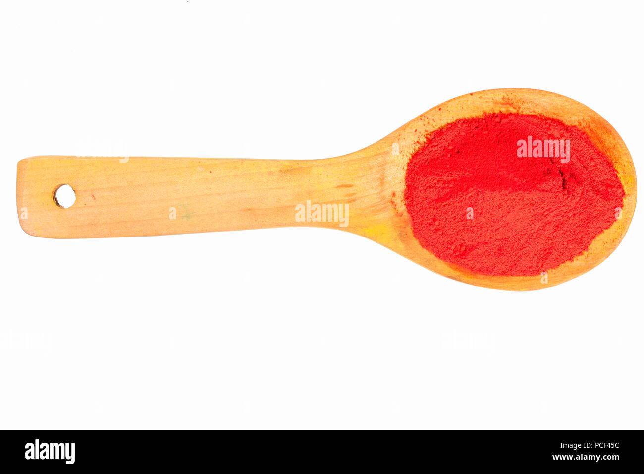 red powder on wooden spoon with clipping path in isolated on white ...