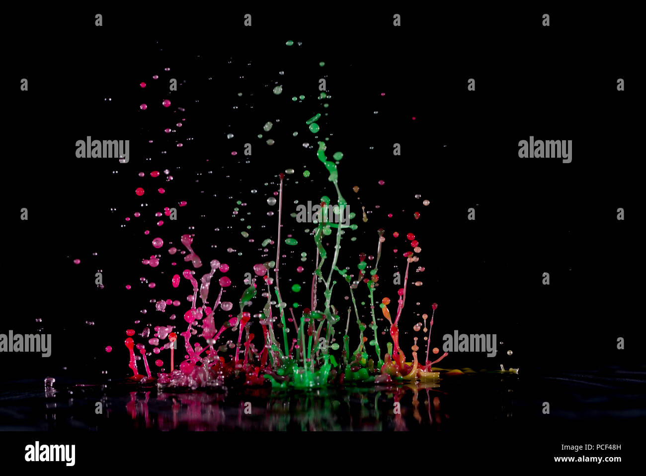 abstract color splash isolated on black background Stock Photo - Alamy