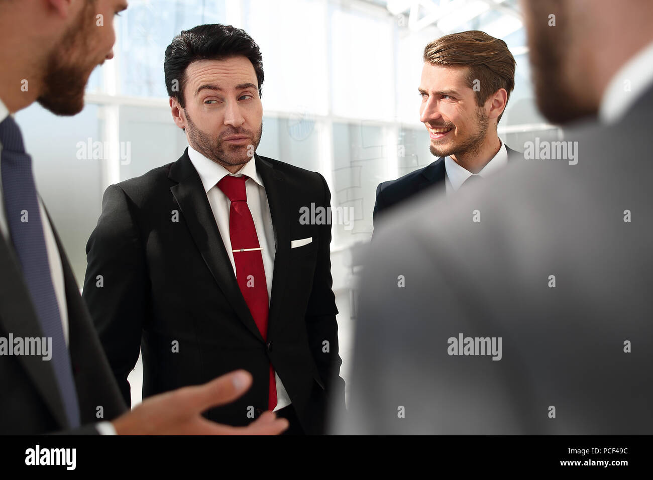 close up.Manager and employees of the company talking standing in the ...