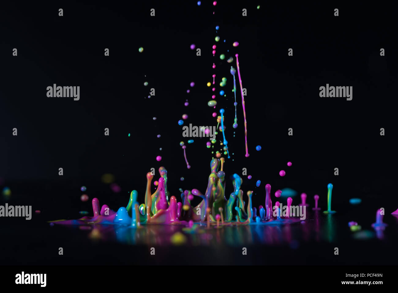 abstract color splash isolated on black background Stock Photo - Alamy
