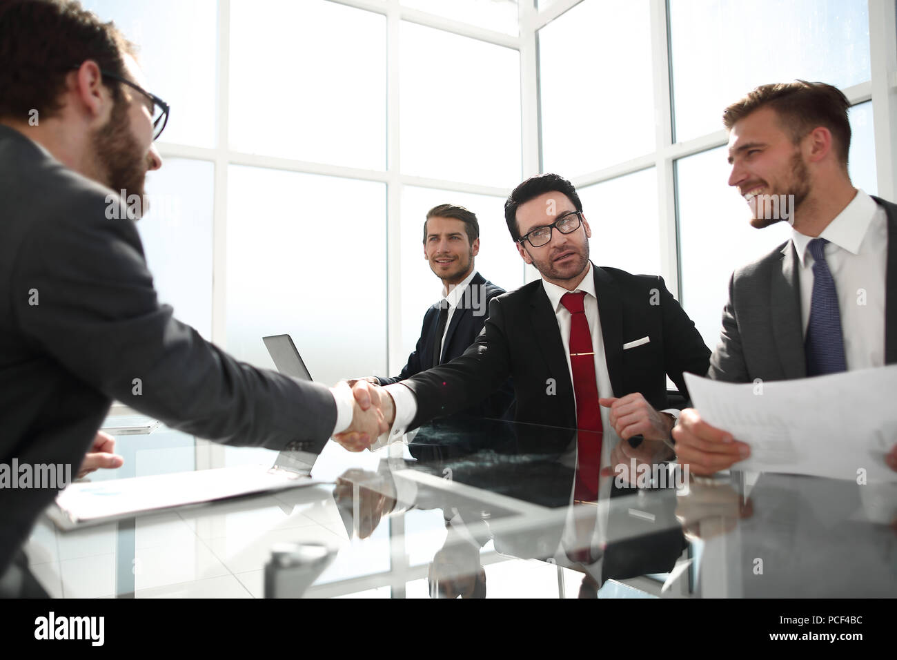 handshake business people over the negotiating table Stock Photo - Alamy