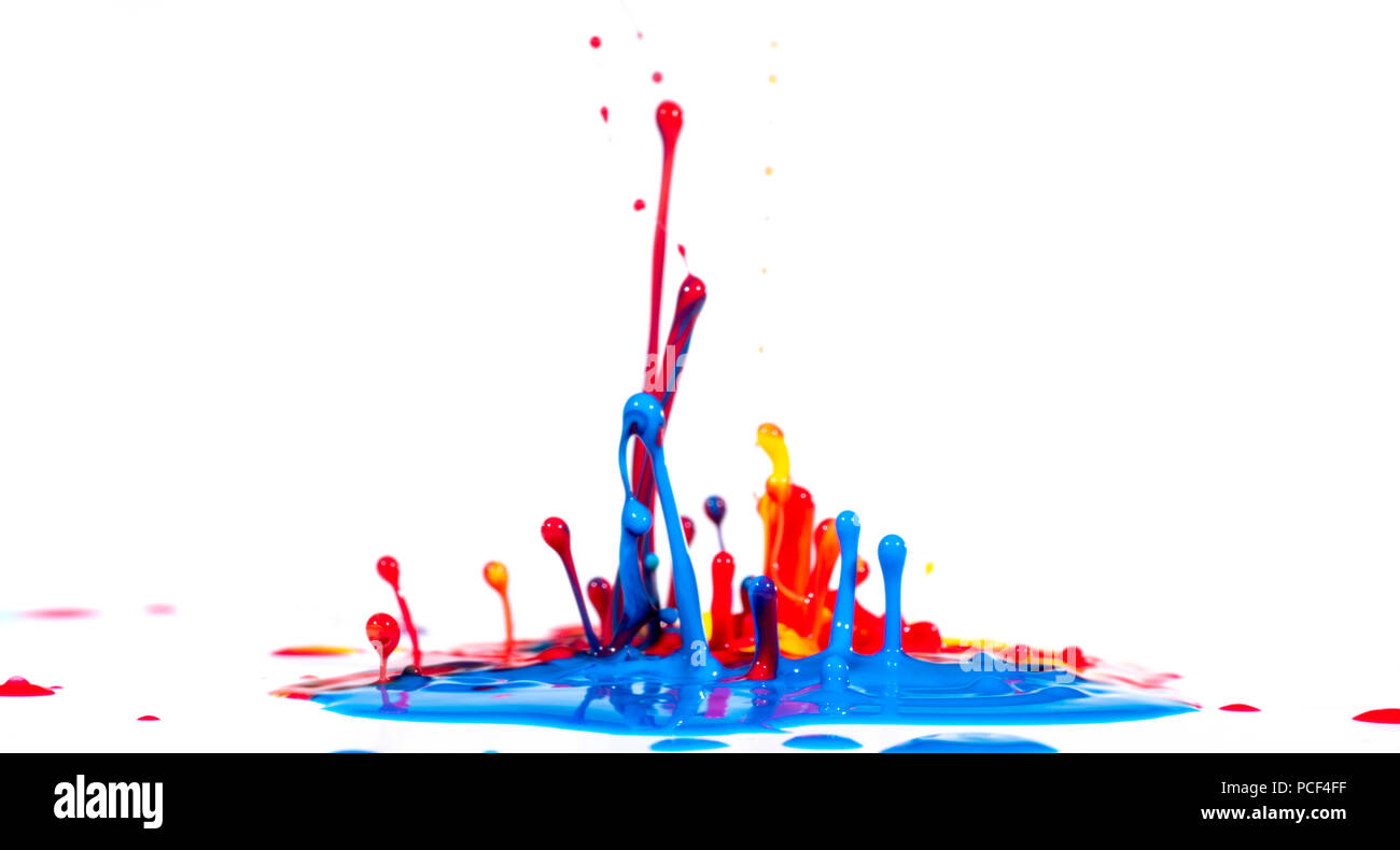 Splash of color ink on white background Stock Photo - Alamy