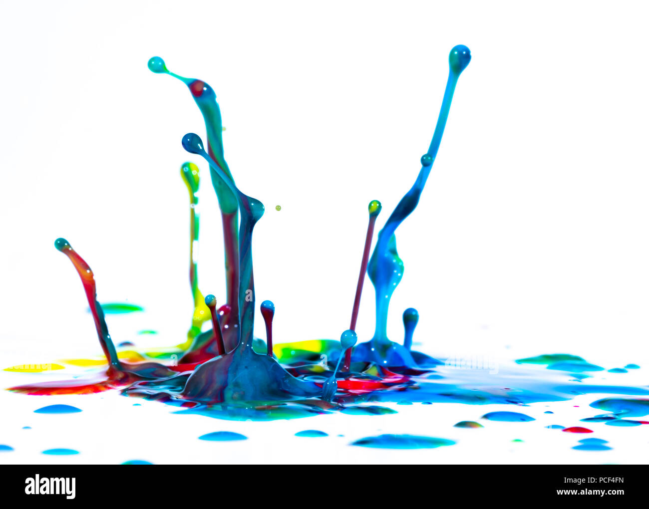 splash of color ink on white background Stock Photo - Alamy