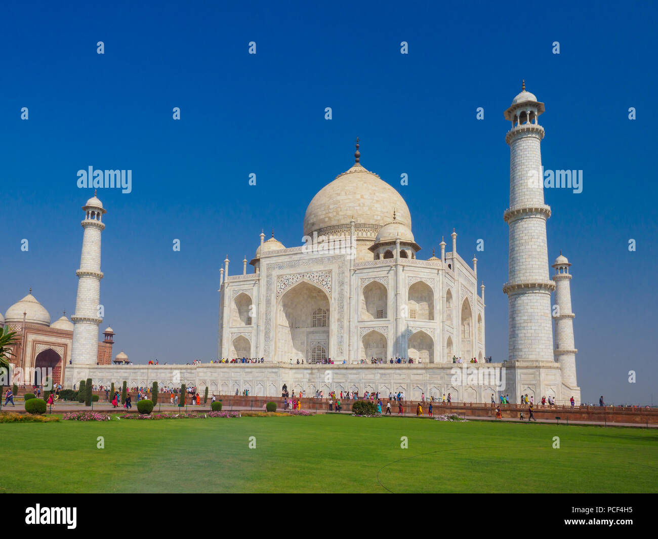 Tourists visiting the Taj Mahal, the ivory-white marble mausoleum in ...