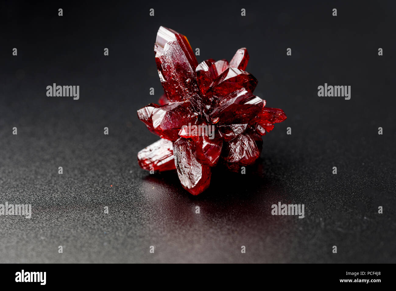 Red natural crystal. Natural mineral Stock Photo - Alamy