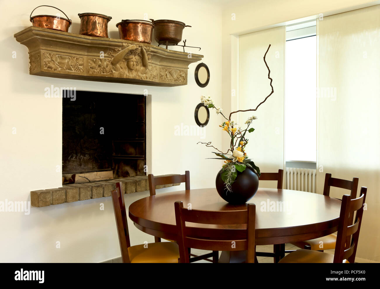 wooden table and fireplace off Stock Photo - Alamy