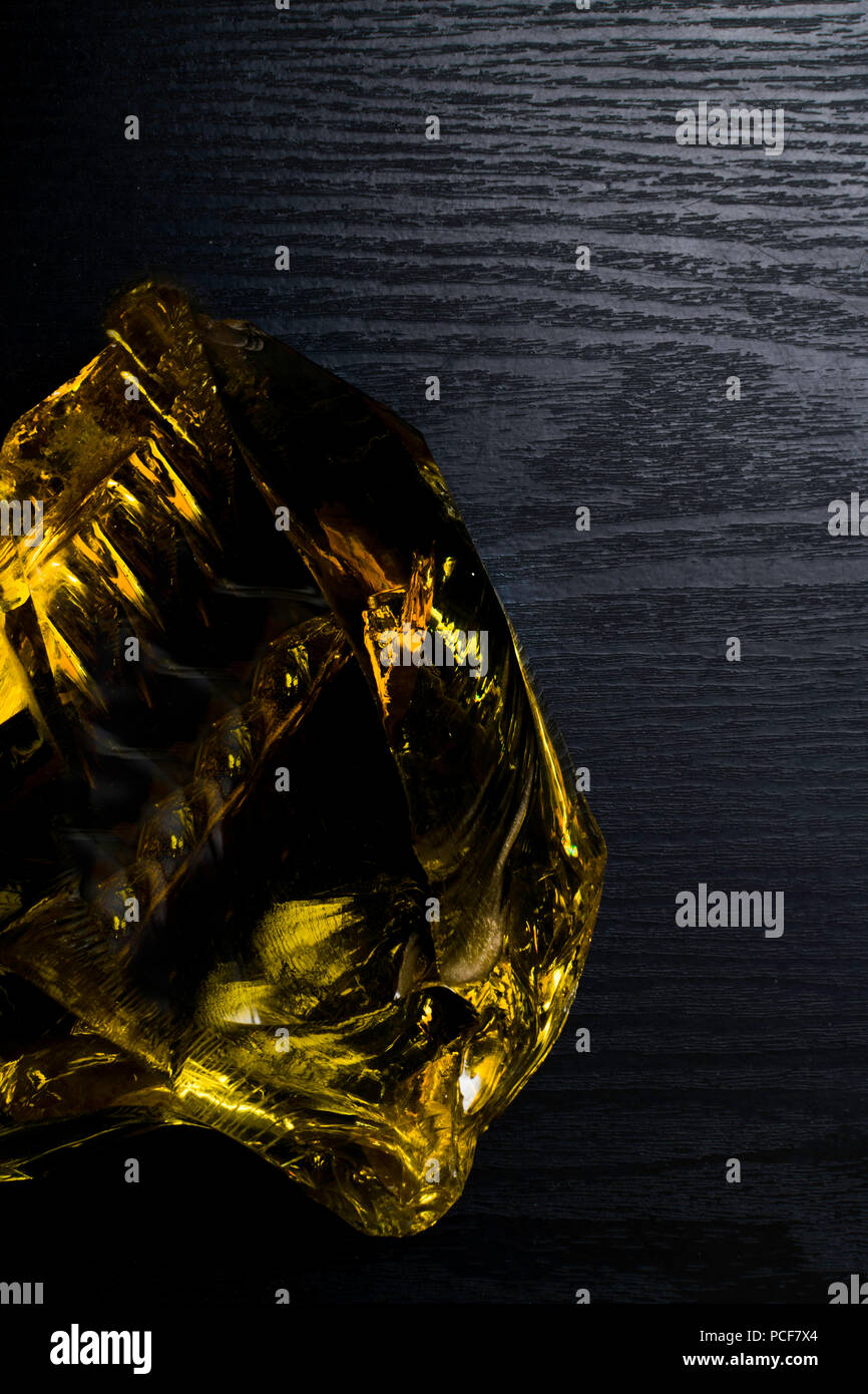 a glass feline cat from yellow amber stone Stock Photo - Alamy