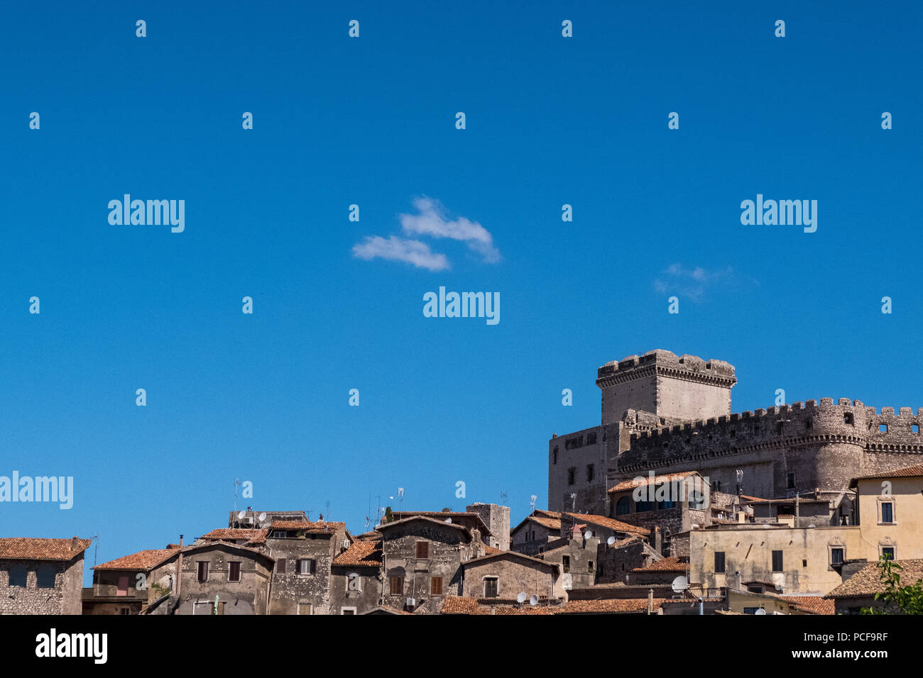 Landscape view of a medieval village with a castle with blue sky ...