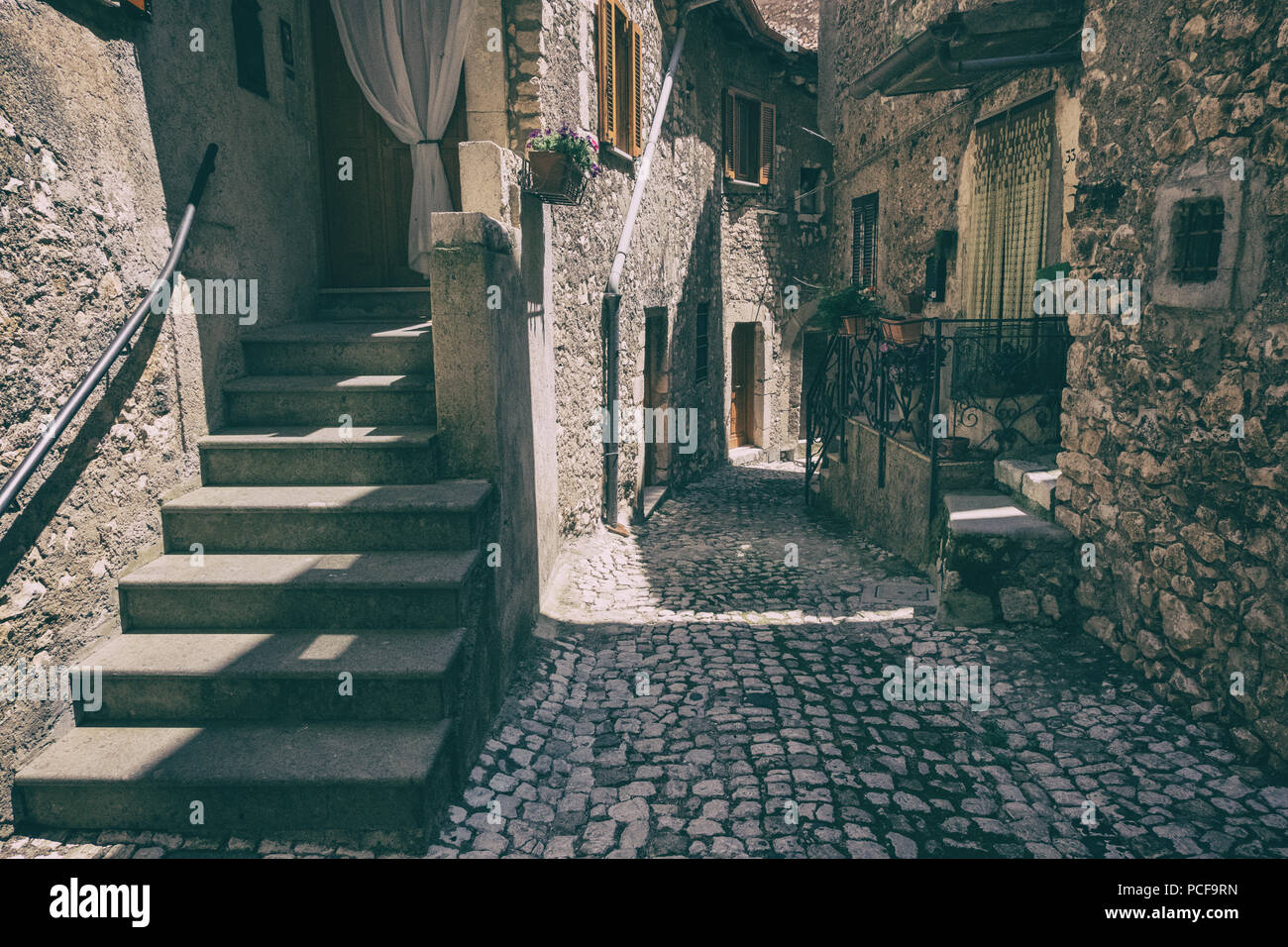Sun light design on a medieval town alleyway Stock Photo - Alamy