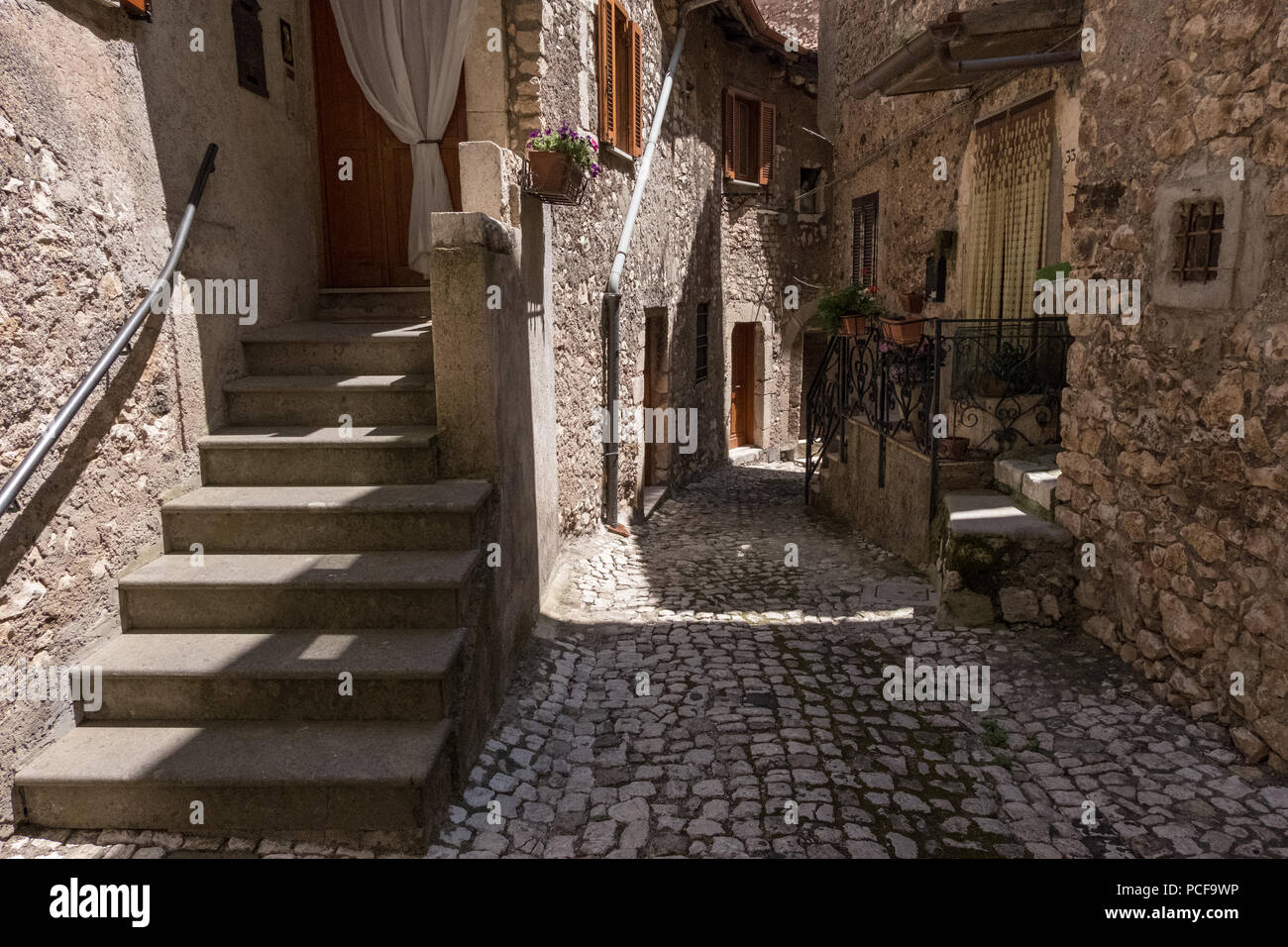 Sun light design on a medieval town path Stock Photo - Alamy