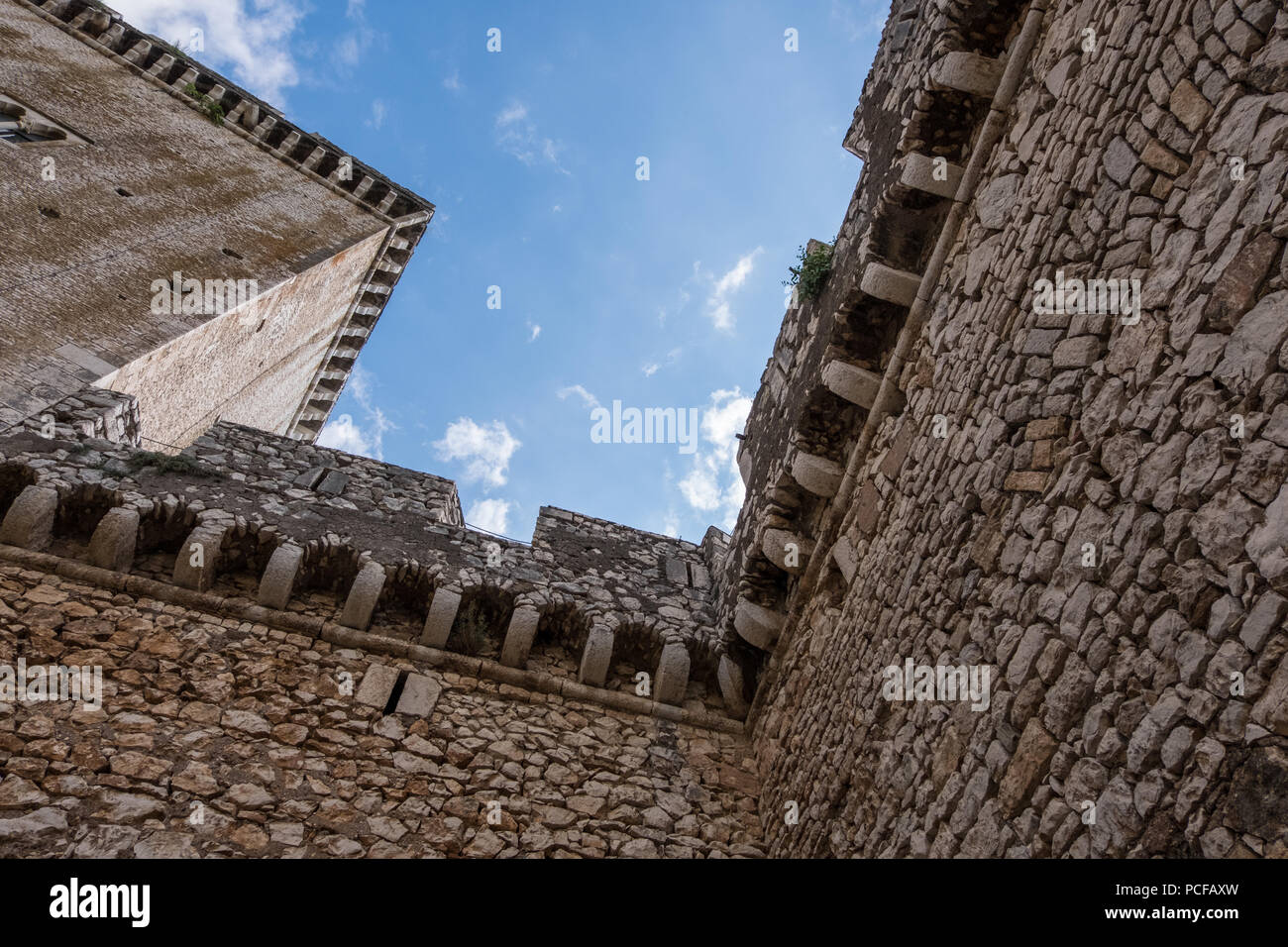 Abstract geometric design image of a castle with blue sky and clouds ...