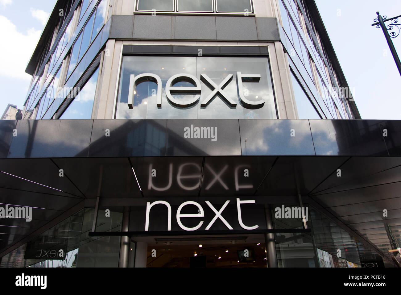 Next clothing logo clothes shop store uk sign hi-res stock photography ...