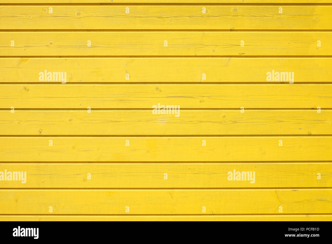 Wooden wall of horizontally arranged yellow painted boards, background ...