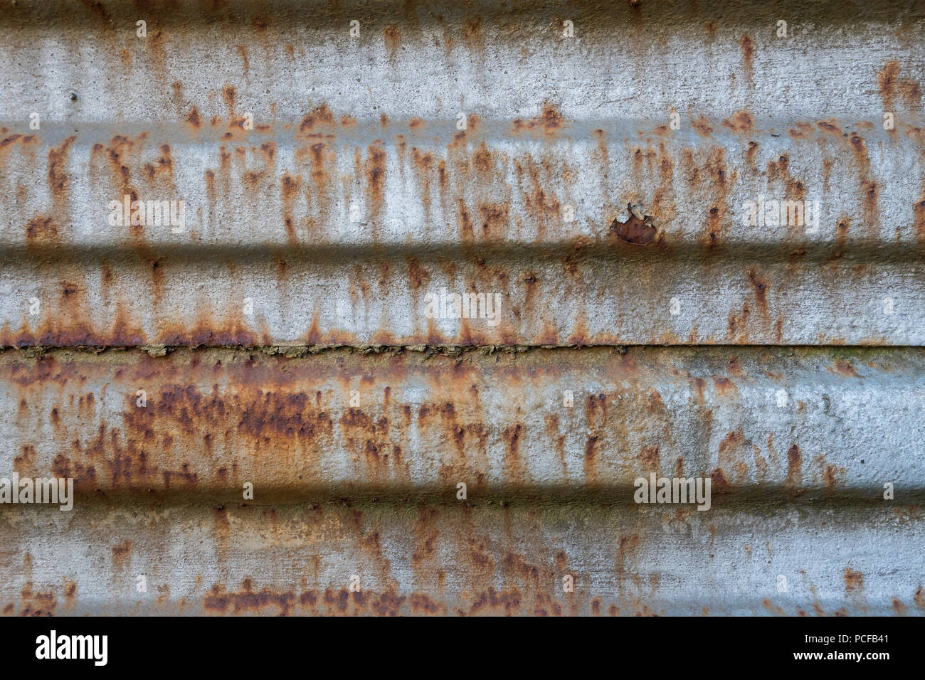 Rusty metal background with old layers of silver paint. Texture rusted ...