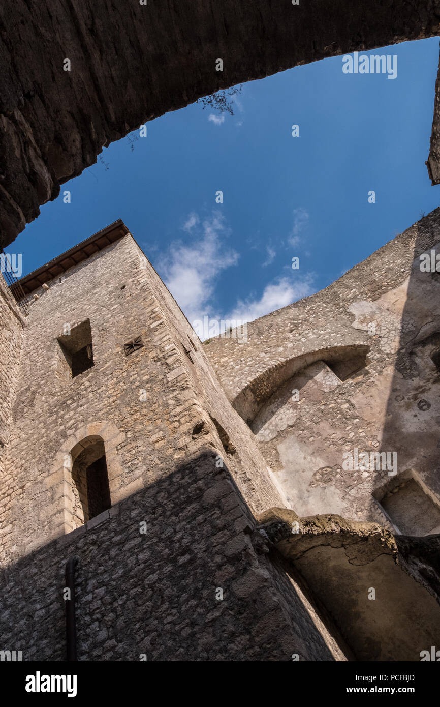 Vertical low angle view of a tower of medieval castle with blue sky ...