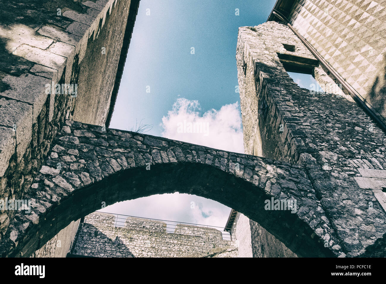 Low angle view of medieval castle arches and walls from an inside ...