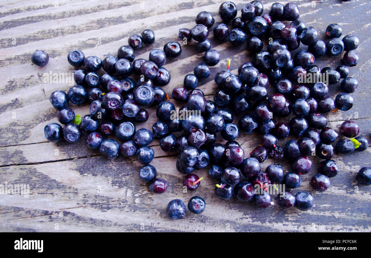 Fresh blueberry on old wooden background. Delicious juicy blueberries ...