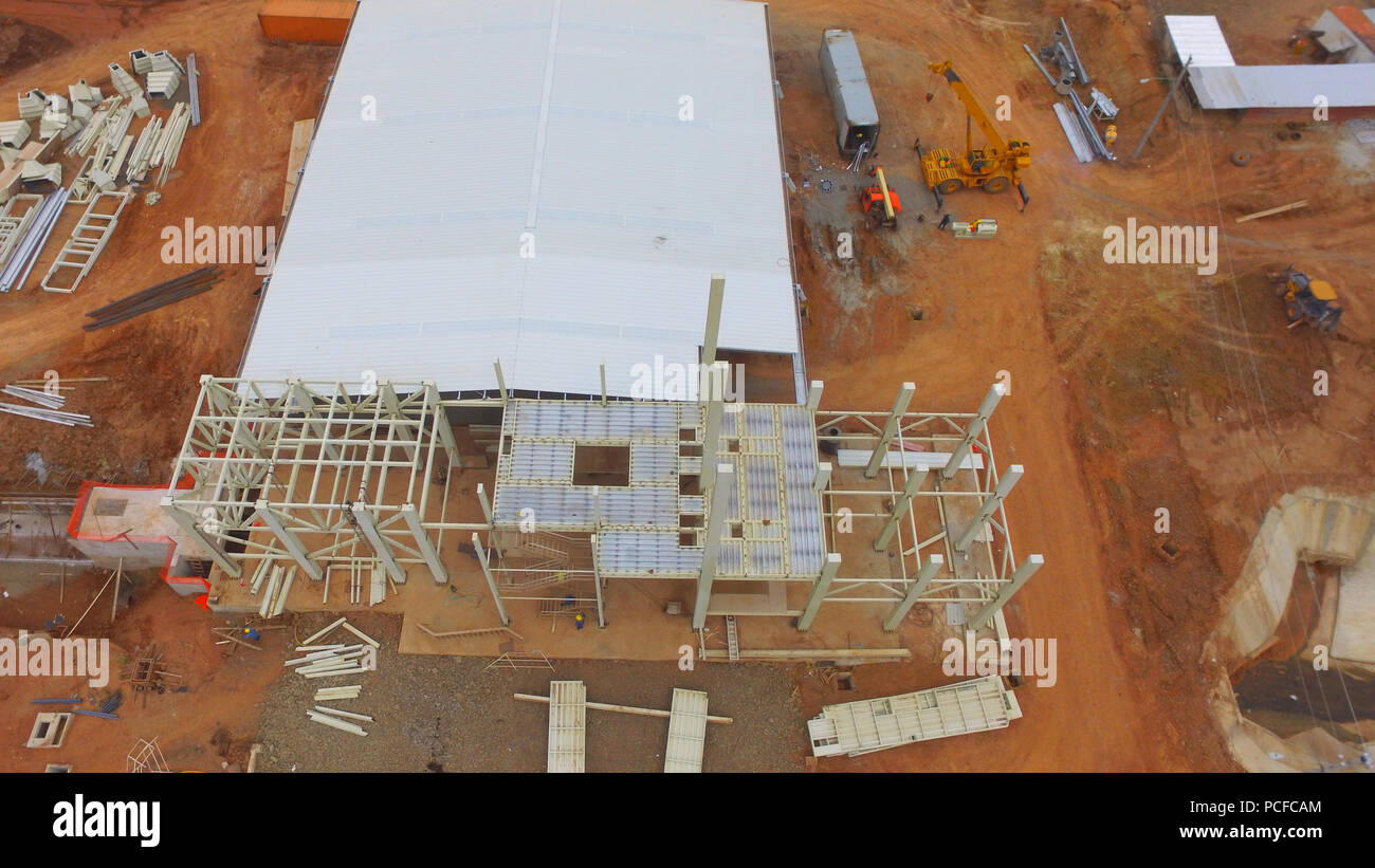 Aerial top view of a steel structure being buikt in a construction site ...