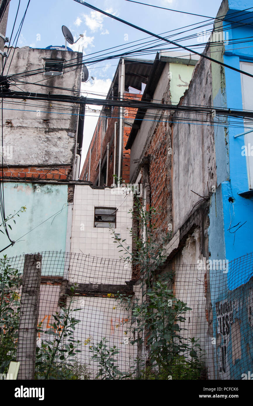 Vertical photo of colourful worn houses of a favela in Brazil Stock ...
