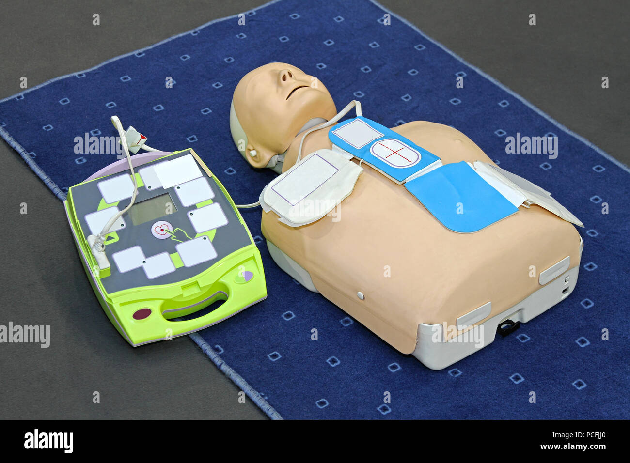 Automated External Defibrillator with training dummy mannequin Stock ...