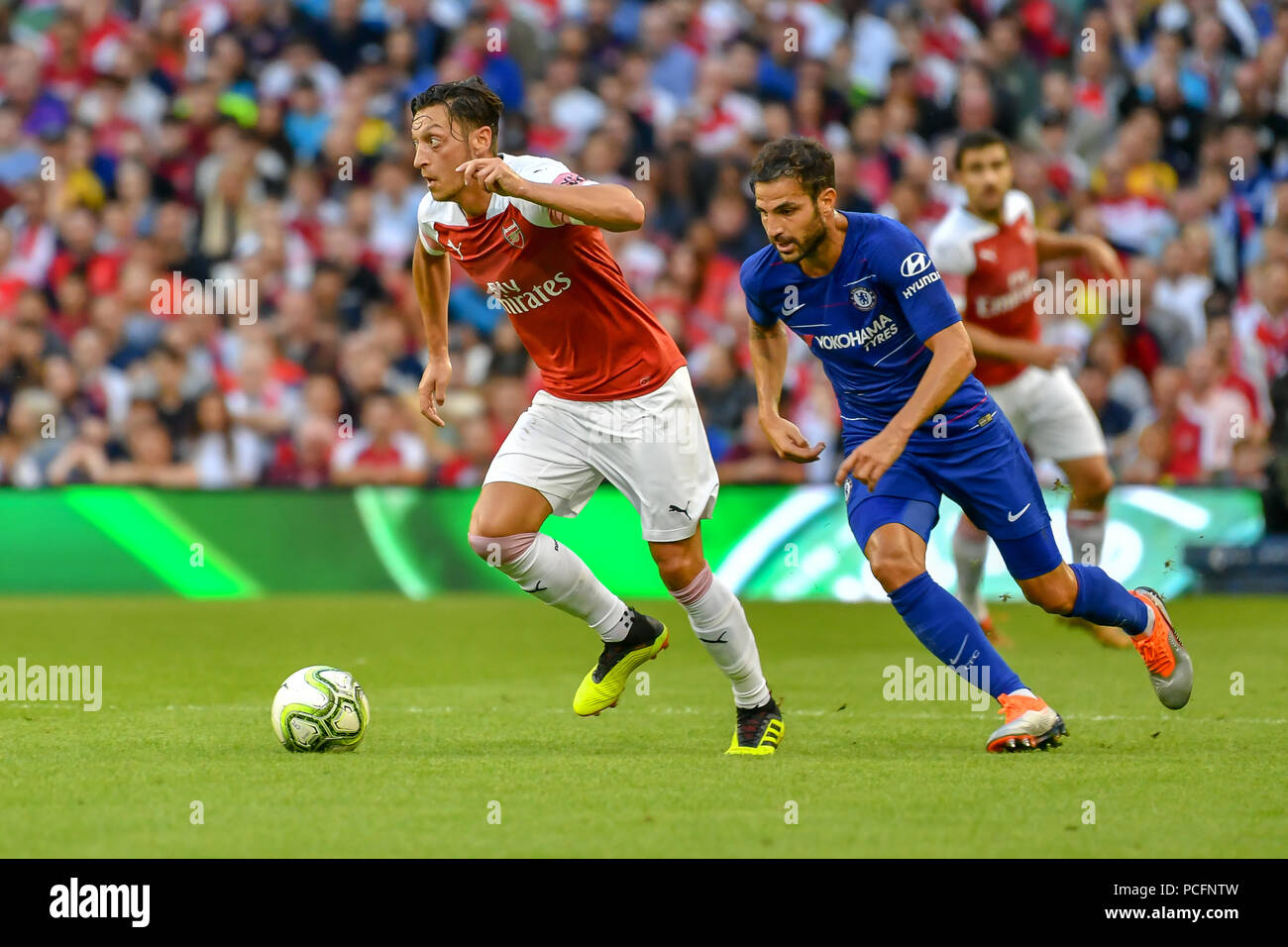 Dublin, Ireland. 1st Aug, 2018. Mesut Ozil of Arsenal runs from Cesc ...