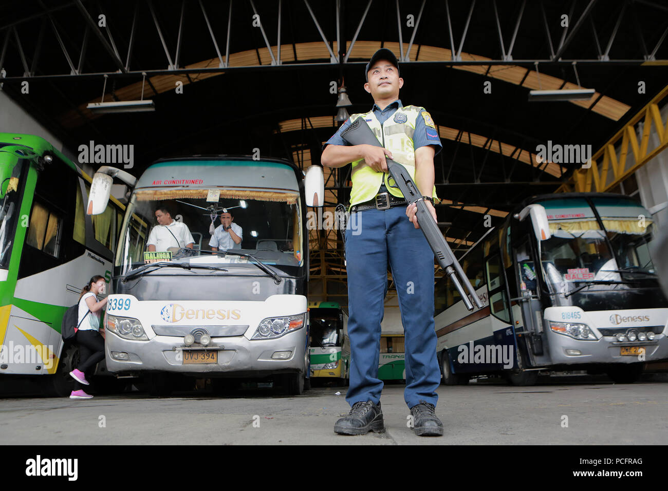 Quezon City, Philippines. 2nd Aug, 2018. A policeman stands guard at a ...