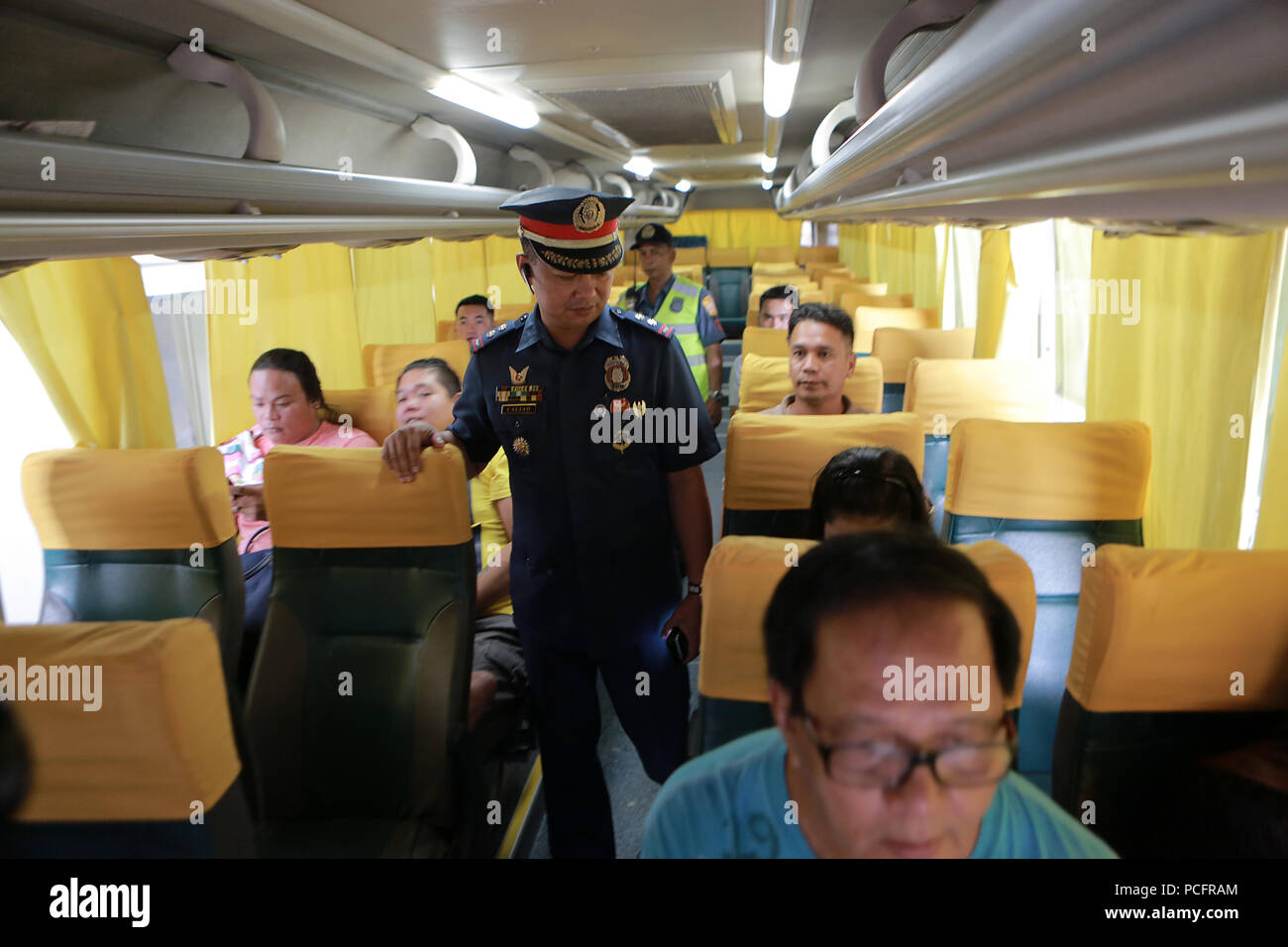 Quezon City, Philippines. 2nd Aug, 2018. A police officer inpsects a ...
