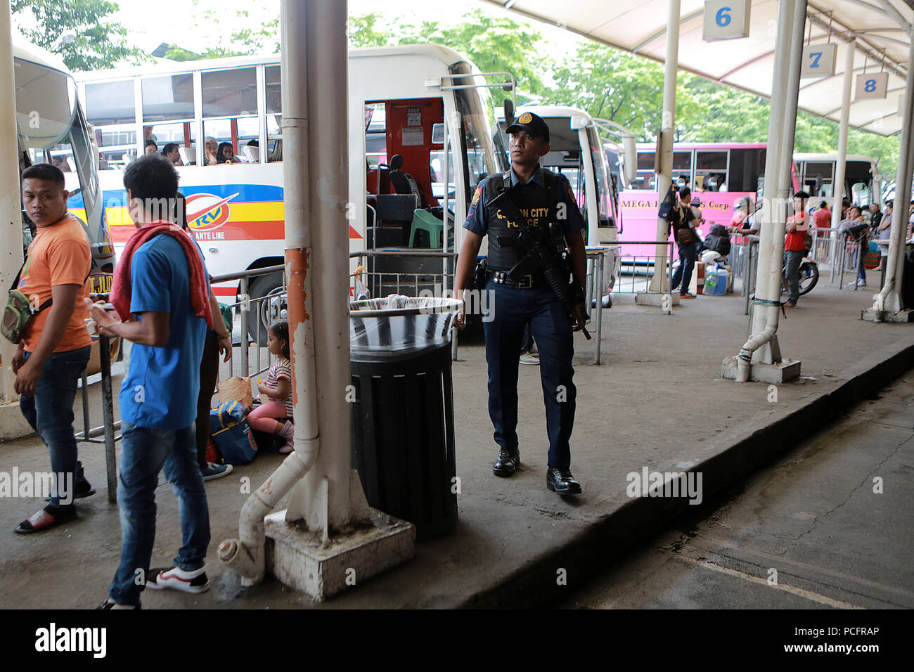 Quezon City, Philippines. 2nd Aug, 2018. A policeman patrols at a bus ...