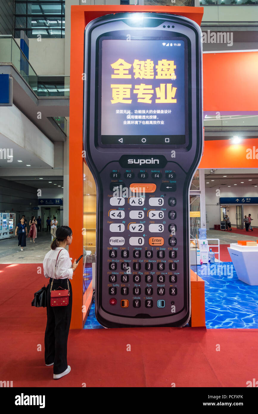 Large cutout of portable RFID reader at a Smart Retail Expo in Shenzhen ...