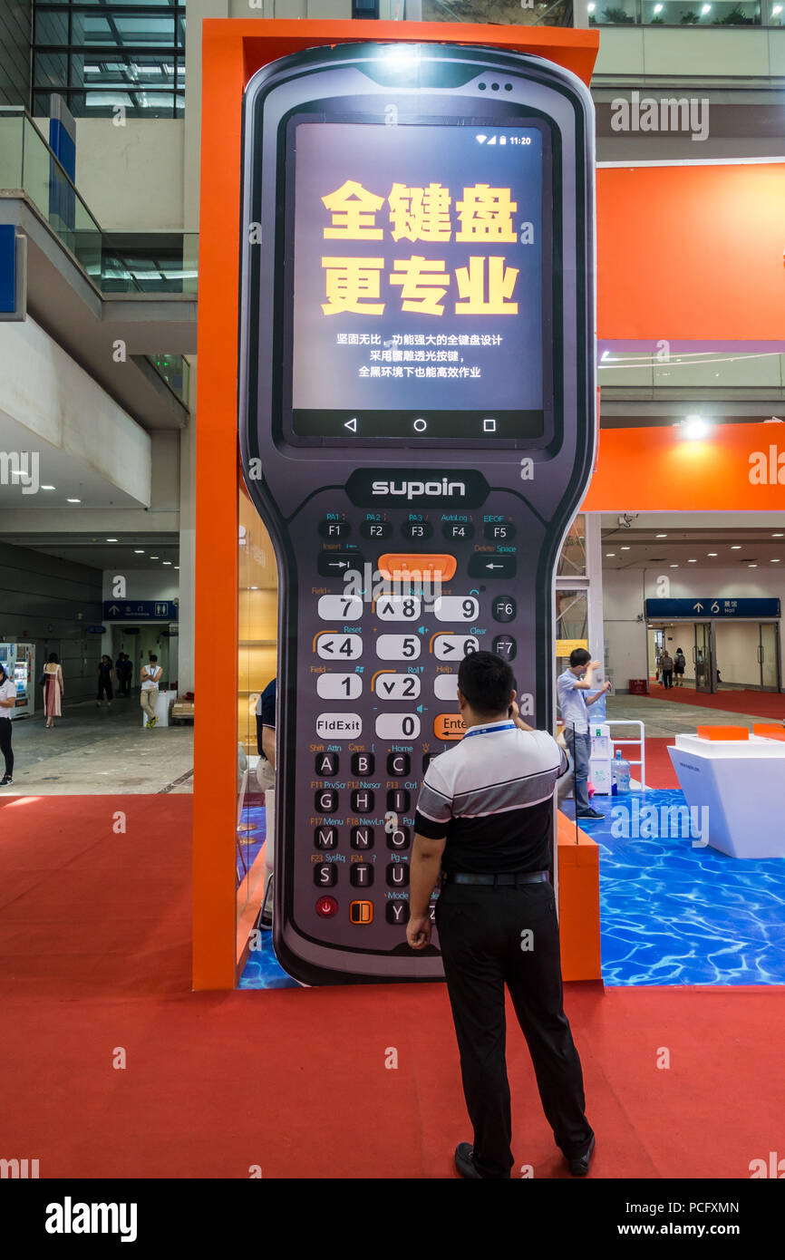Large cutout of portable RFID reader at a Smart Retail Expo in Shenzhen ...
