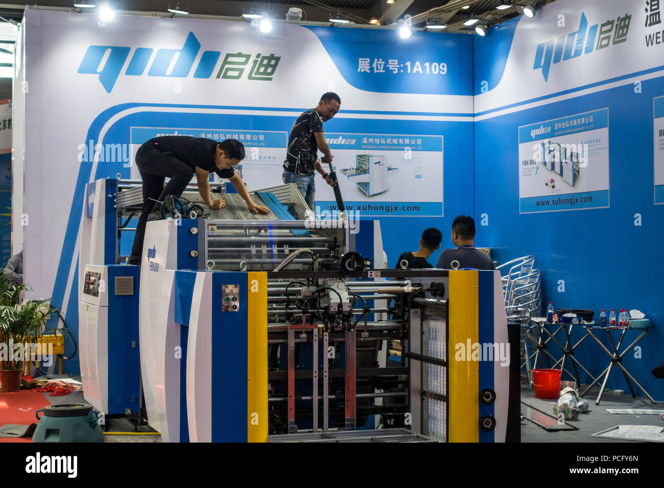 Chinese workers assembling industrial RFID machinery at Smart Retail ...