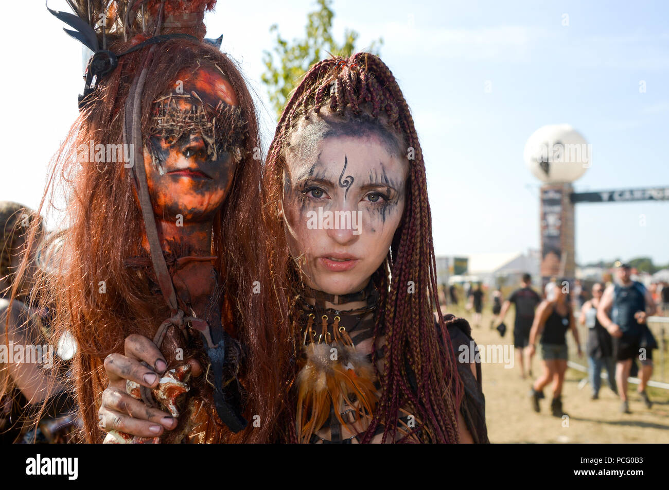 Wacken, Germany. 02nd Aug, 2018. Festival visitors wear costumes at the ...