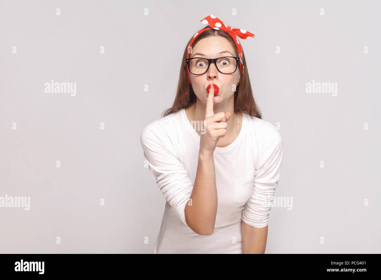 shh! this is secret. portrait of beautiful emotional young woman in ...