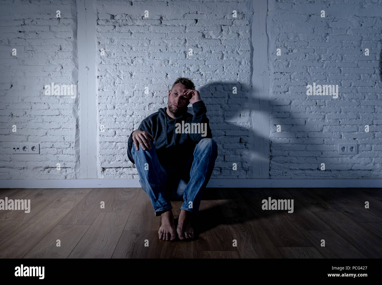Lonely man suffering from depression Stock Photo - Alamy