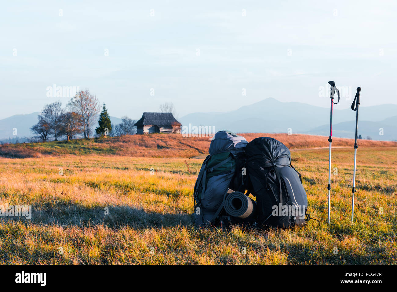 Two backpacks in mountains valley Stock Photo - Alamy