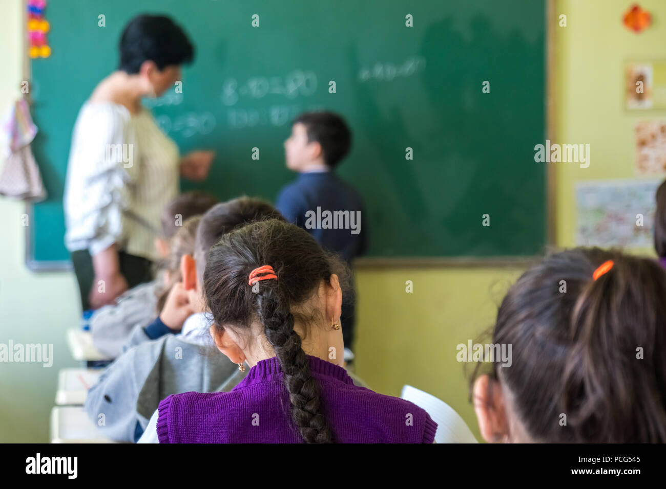 School children are participating actively in class. Lesson Stock Photo ...