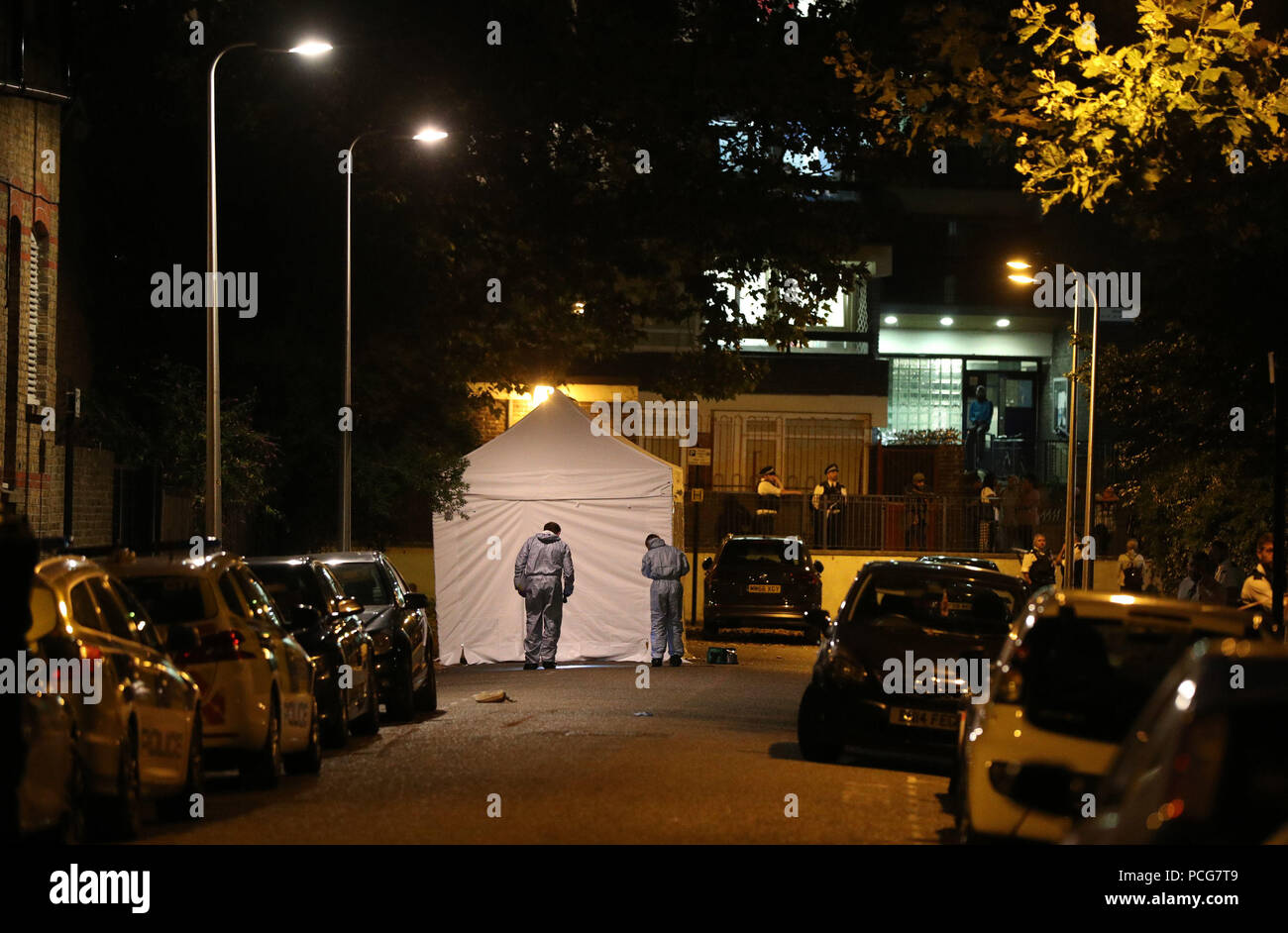 Forensic officers in Warham Street in Camberwell, south London, where a ...